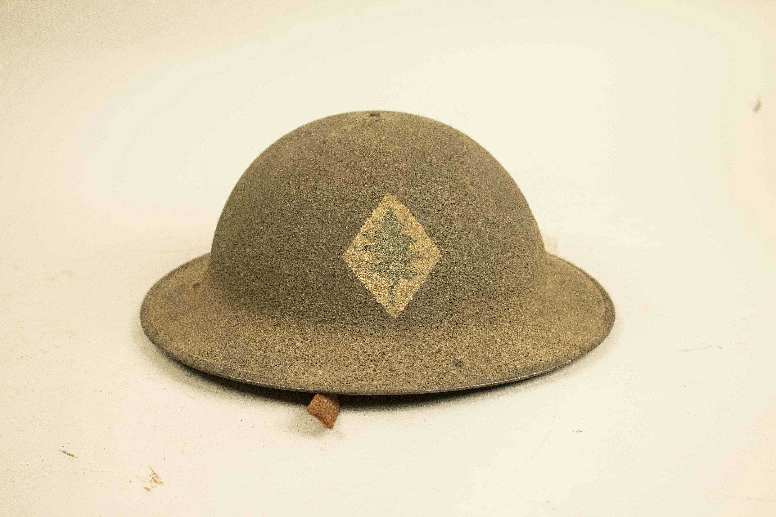 2 US WWI Painted Helmets and 4 Overseas Caps | Witherell's Auction House