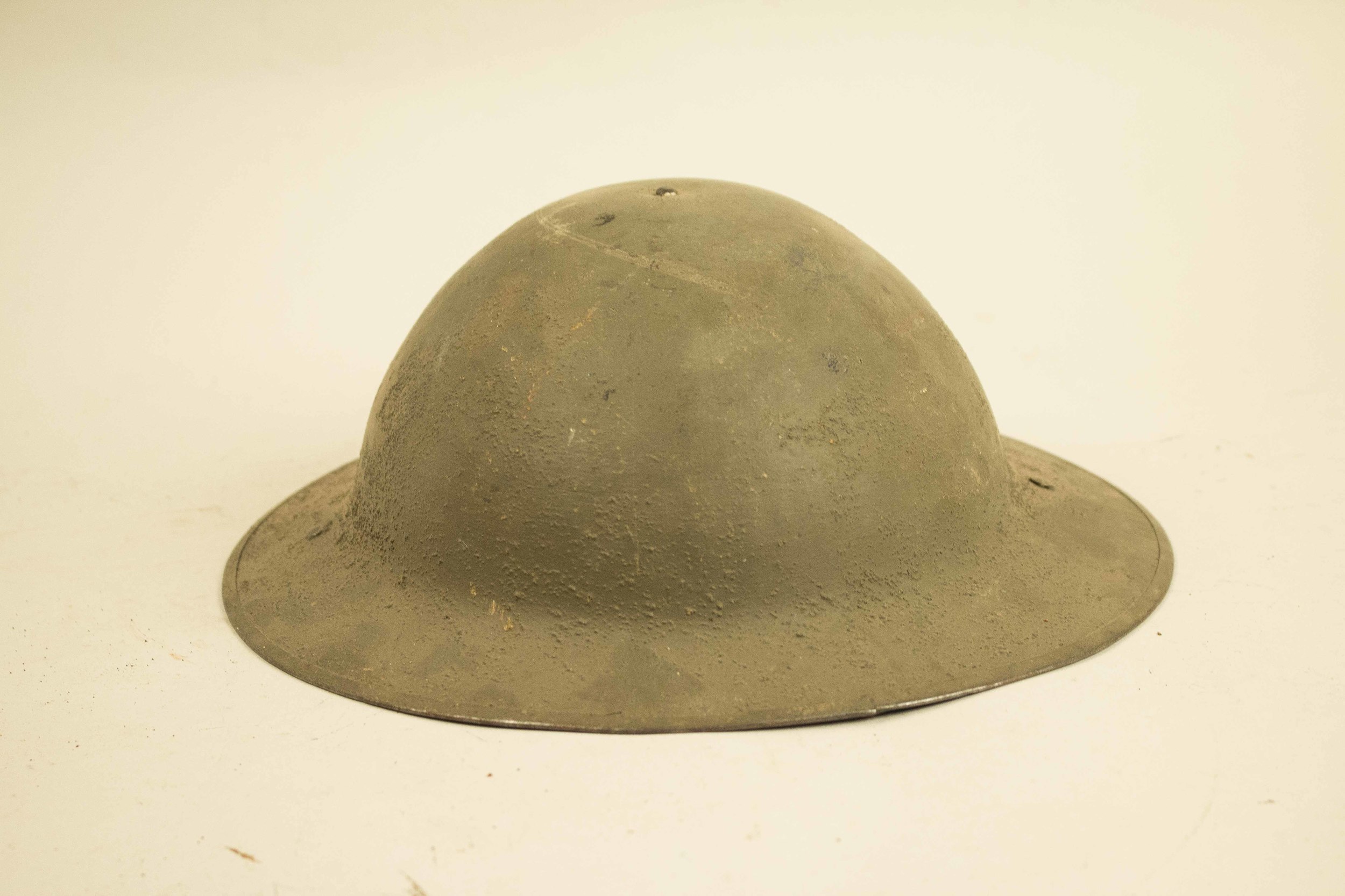 2 US WWI Painted Helmets and 4 Overseas Caps | Witherell's Auction House