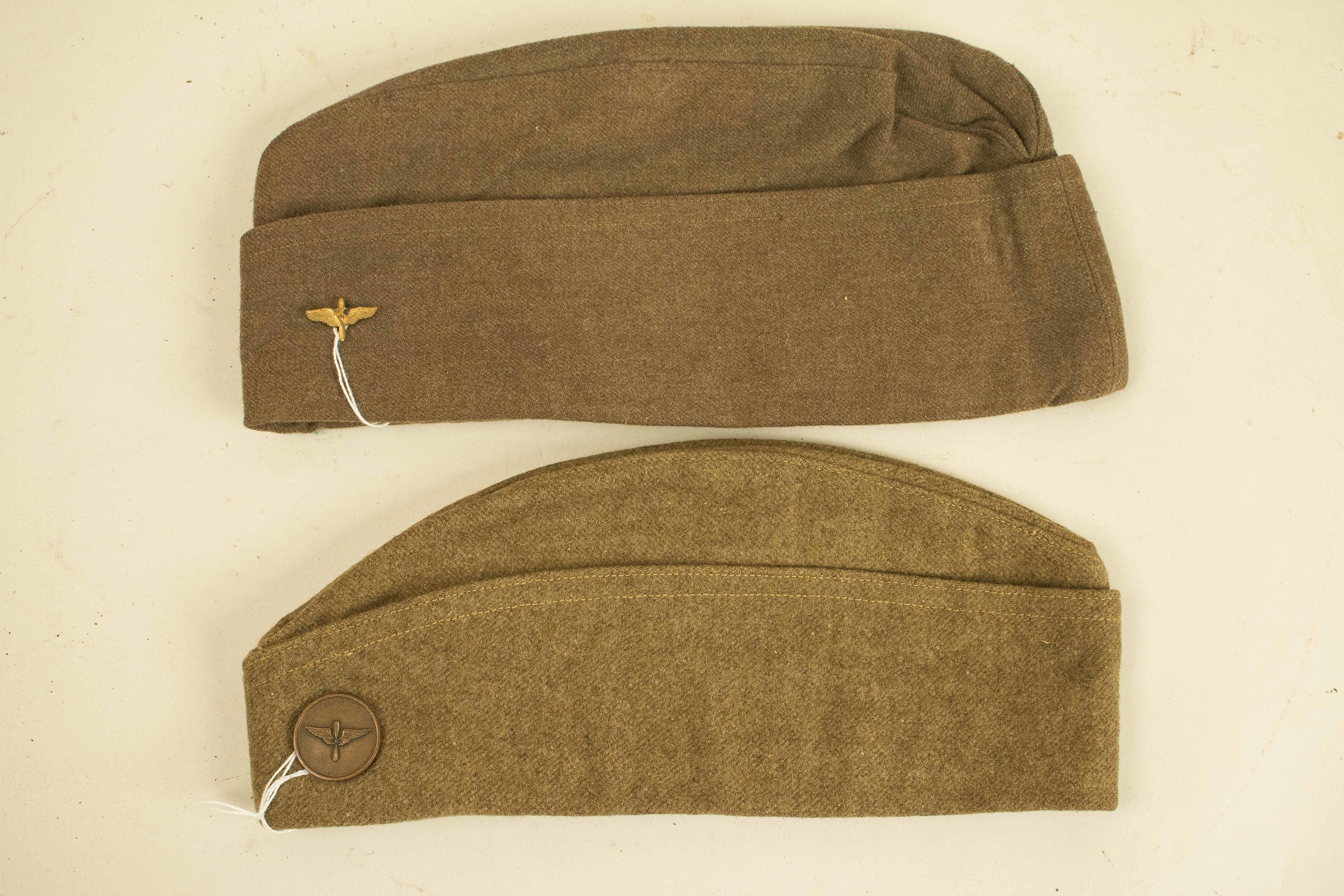 2 US WWI Painted Helmets and 4 Overseas Caps | Witherell's Auction House