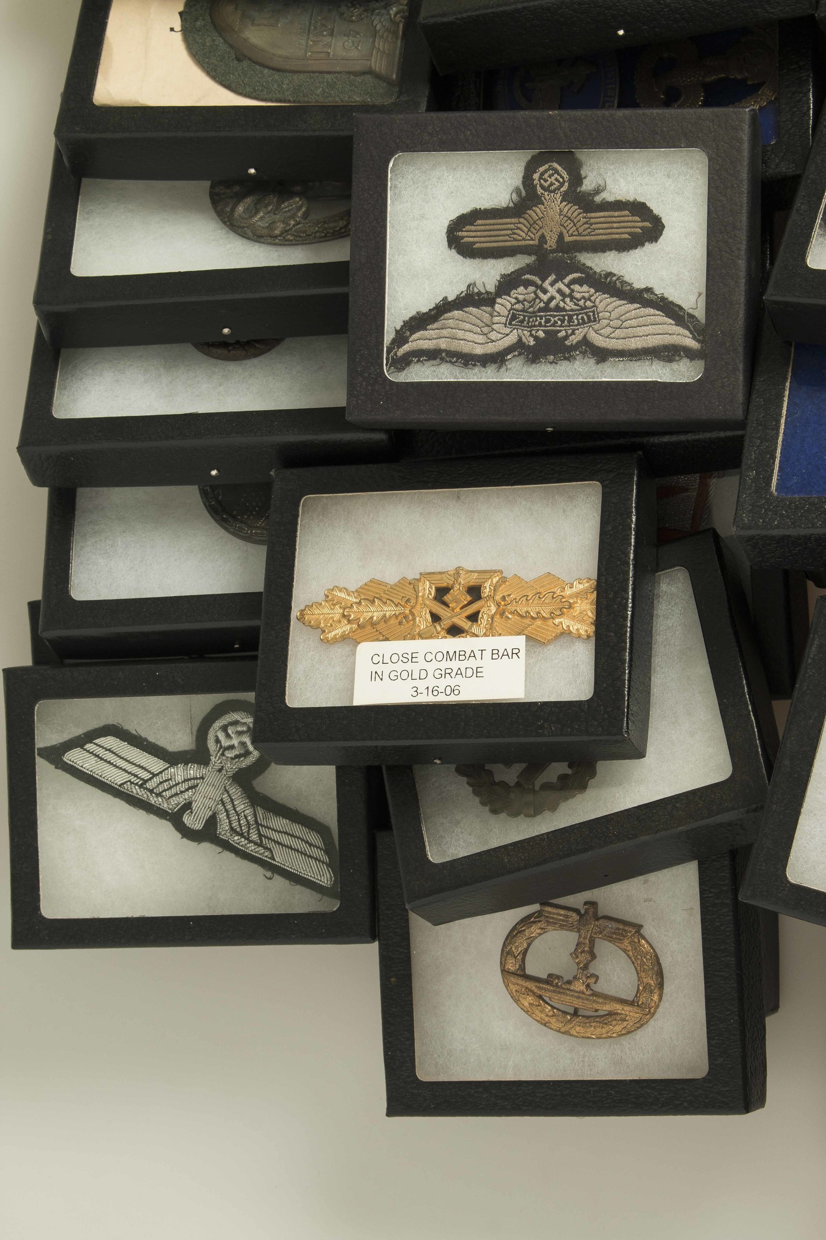 40 3rd Reich Badges in individual Riker mounts | Witherell's Auction House