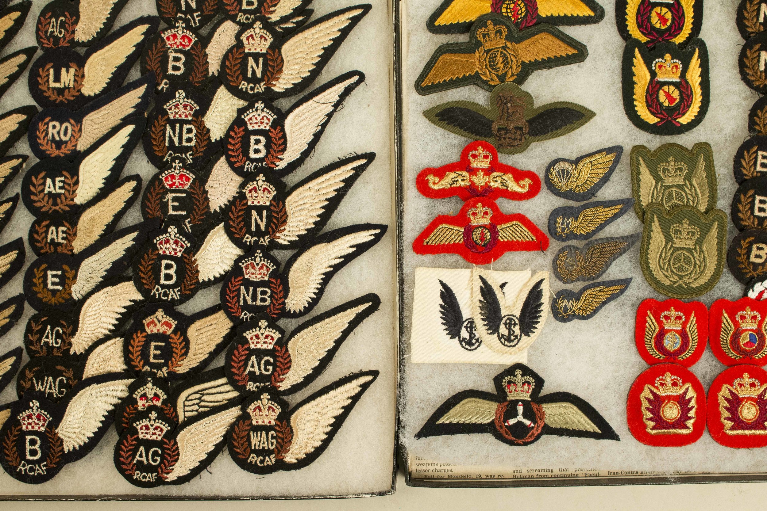 2 Frames of Cloth Canadian and British Wings, incl. 62 half-wings, 33 ...