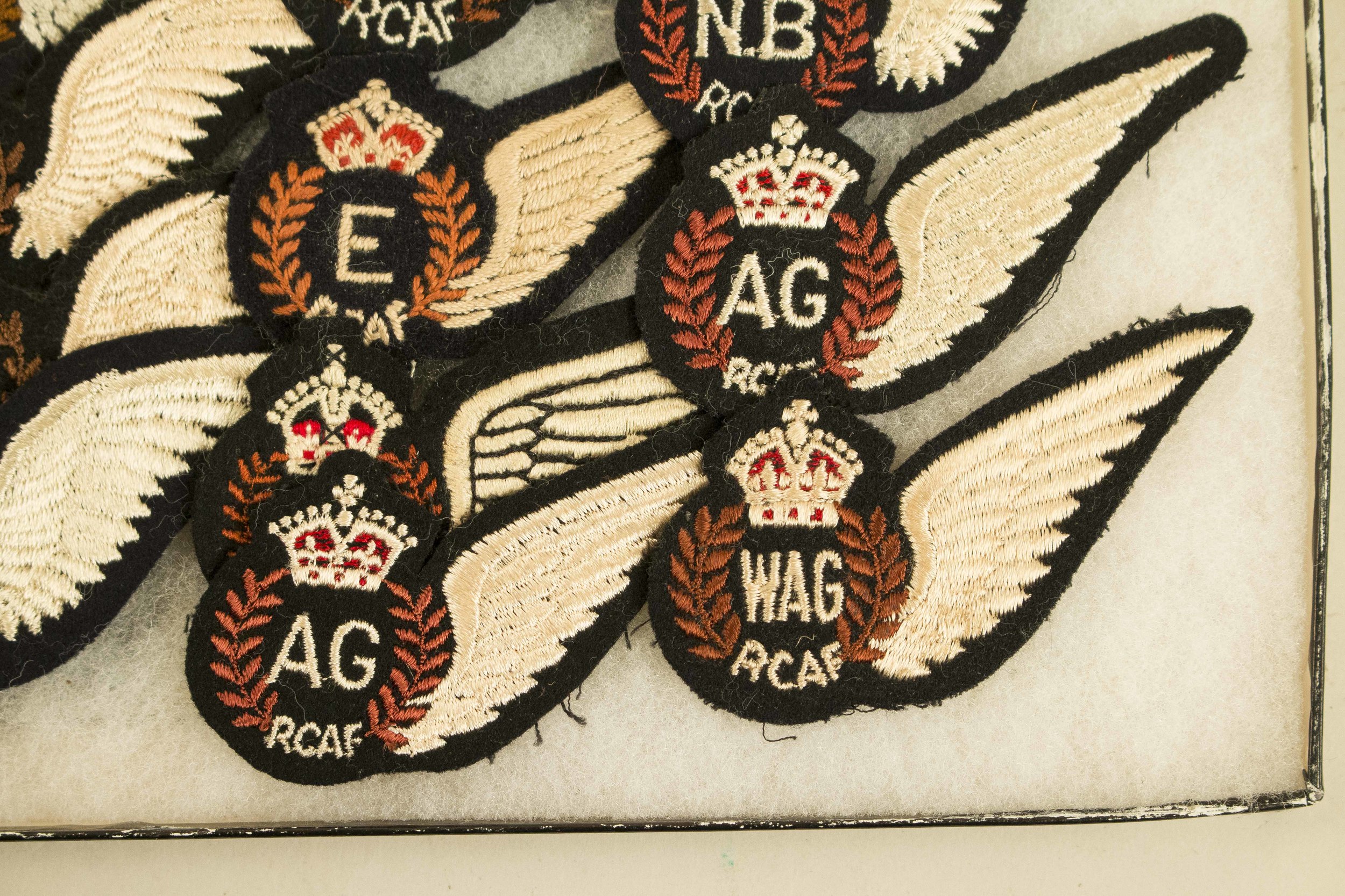 2 Frames of Cloth Canadian and British Wings, incl. 62 half-wings, 33 ...