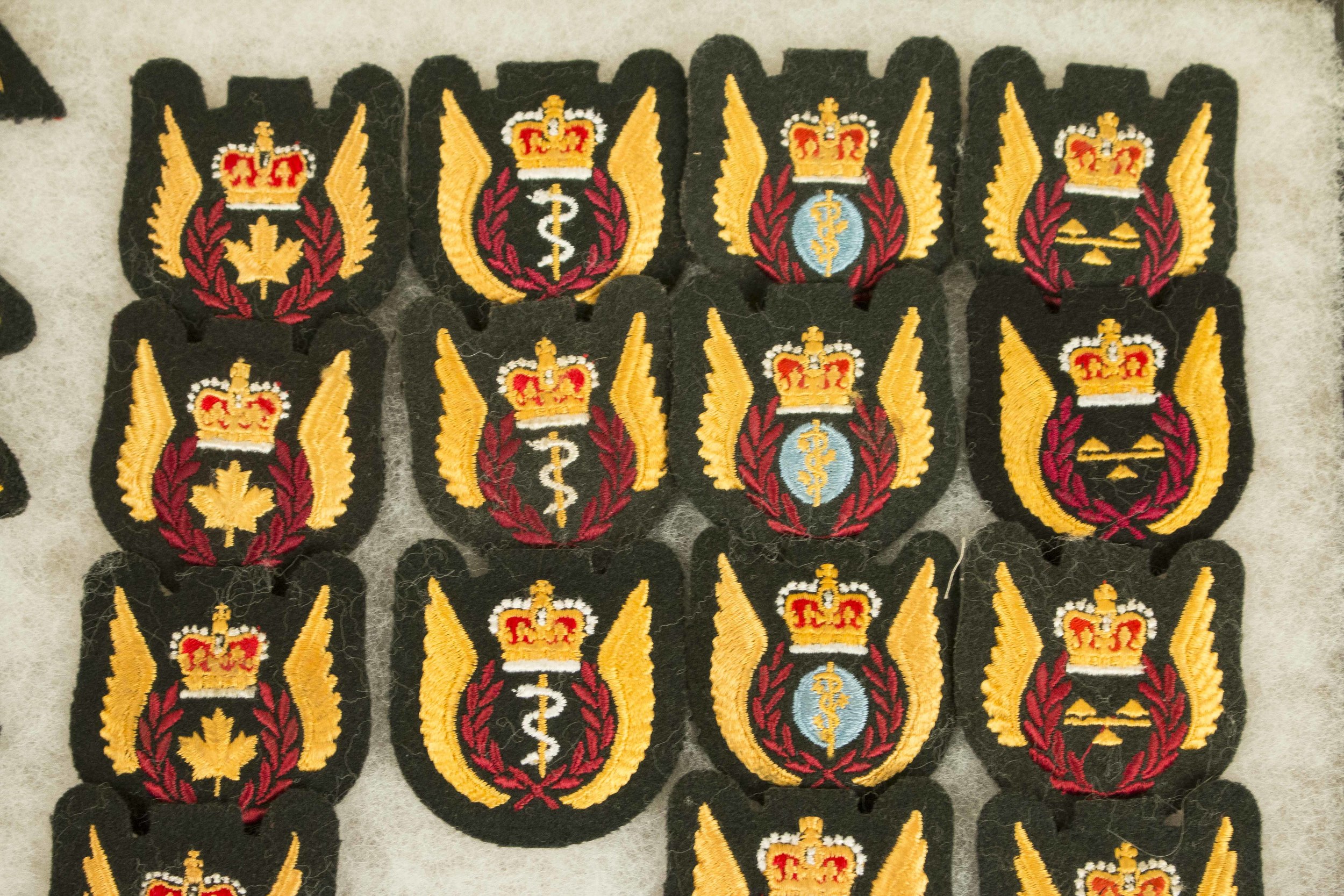 2 Frames of Cloth Canadian and British Wings, incl. 62 half-wings, 33 ...
