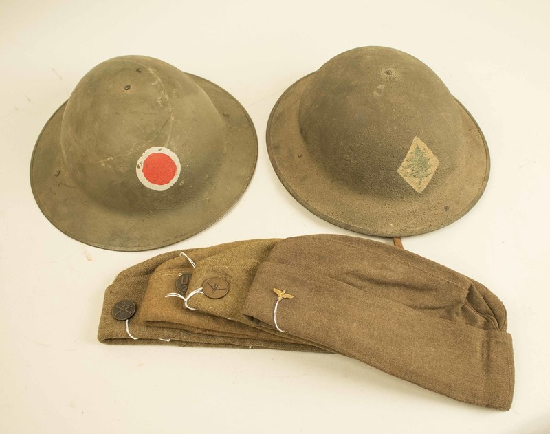2 US WWI Painted Helmets and 4 Overseas Caps | Witherell's Auction House
